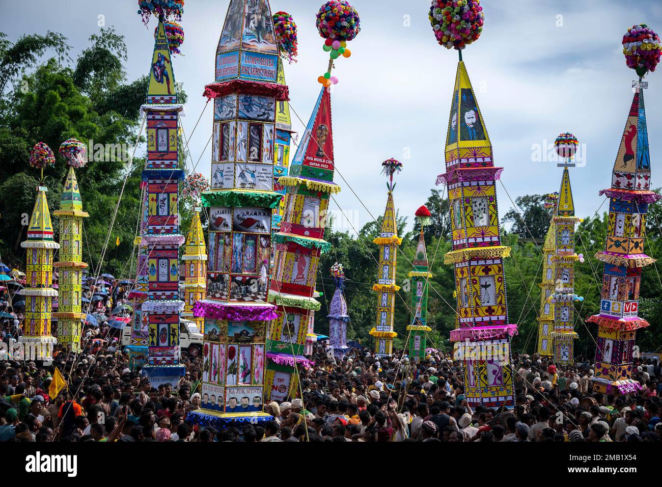 Pnar, or Jaintia, tribals carry 'Rongs' or chariots and dance in muddy ...