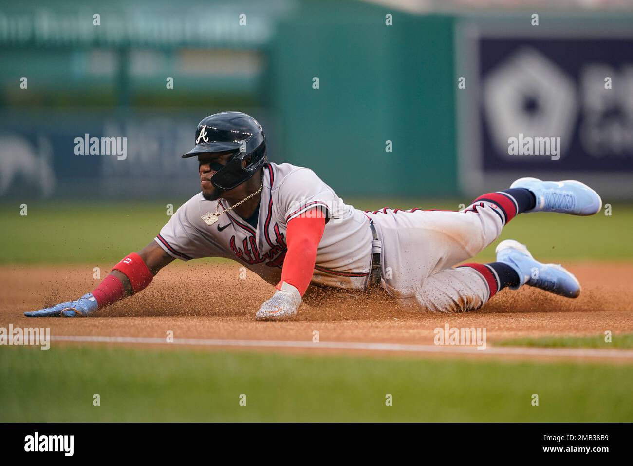 Atlanta Braves' Ronald Acuna Jr. slides safely into third base after a ...