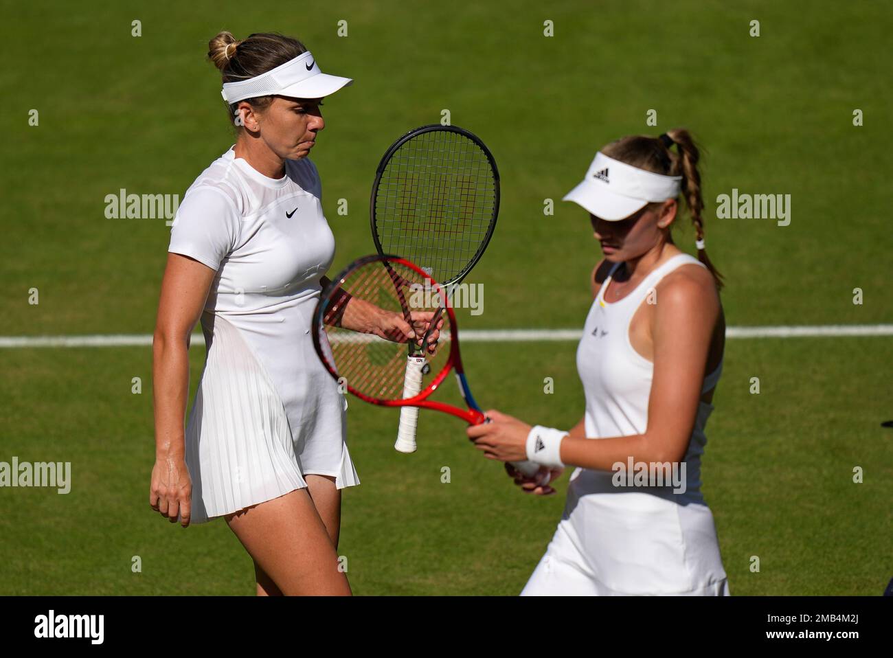 Romania's Simona Halep, left, and Kazakhstan's Elena Rybakina change ...