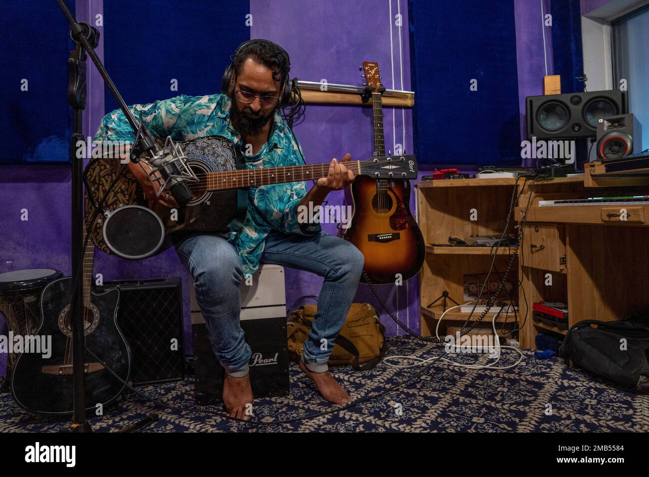 Zeeshan Nabi, a Kashmiri Musician and singer records music inside his ...