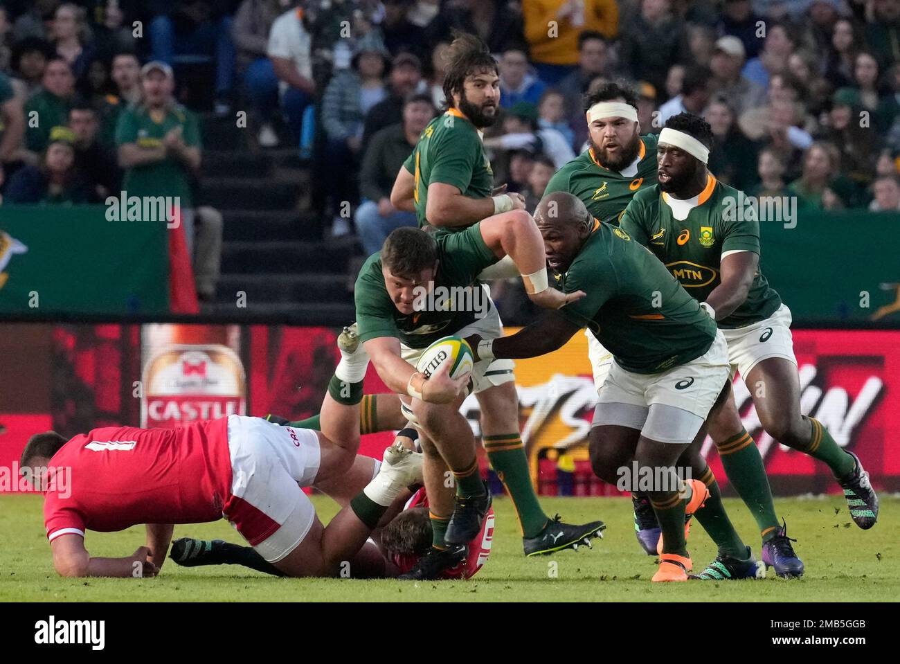 South Africa's Jasper Wiese, center, runs with the ball as Wales ...
