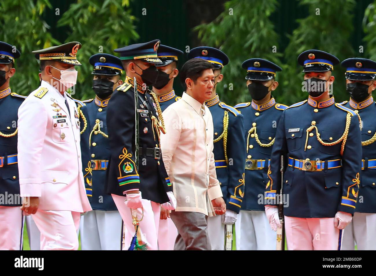 Philippine President Ferdinand Marcos Jr., right, reviews the honor ...