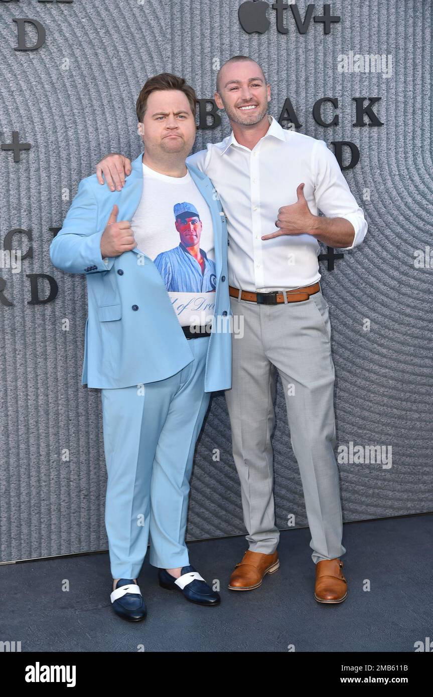Paul Walter Hauser, left, and Jake McLaughlin arrive at the premiere of ...