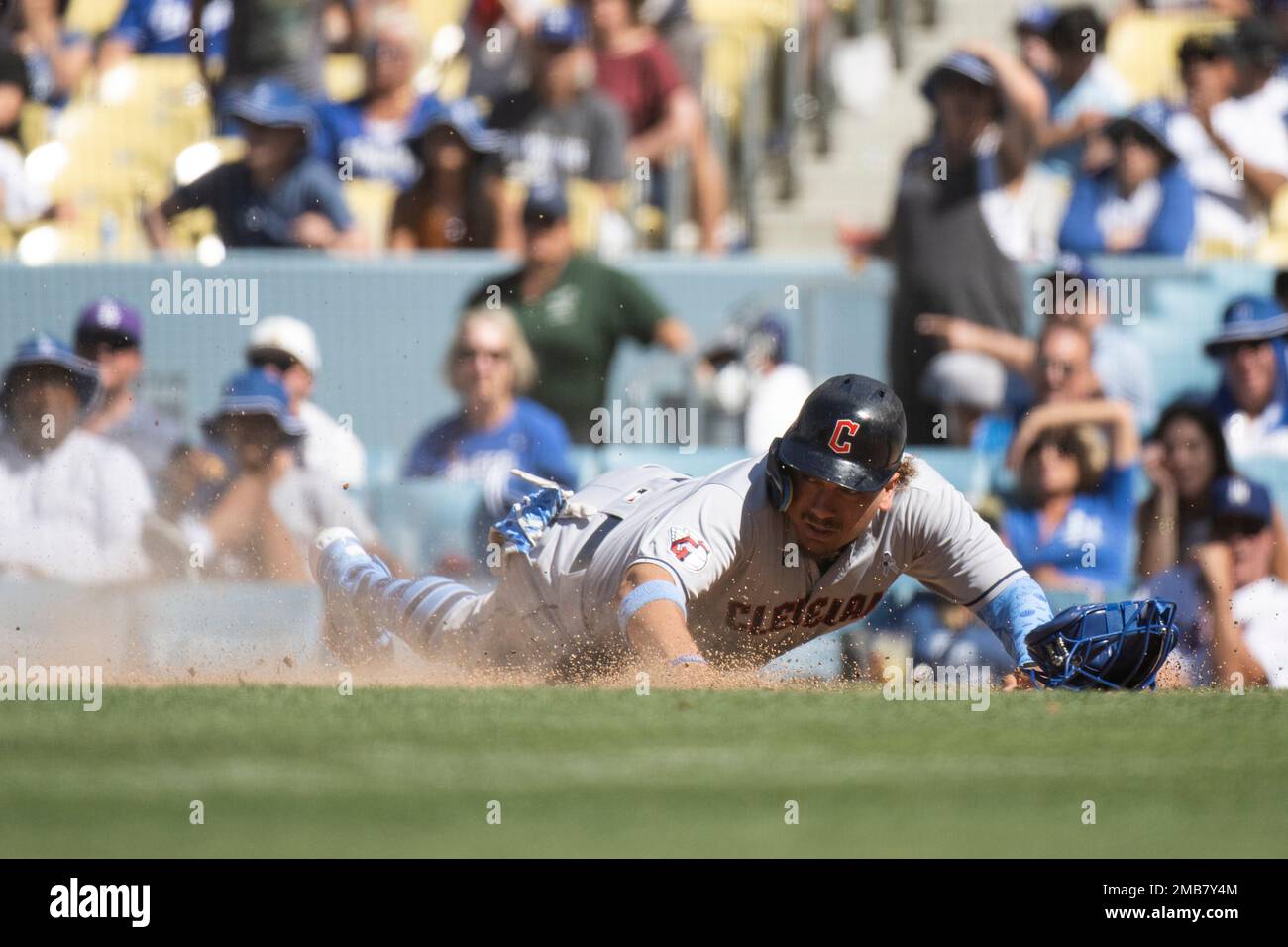 Cleveland Guardians' Josh Naylor slides to score on a sacrifice fly by ...