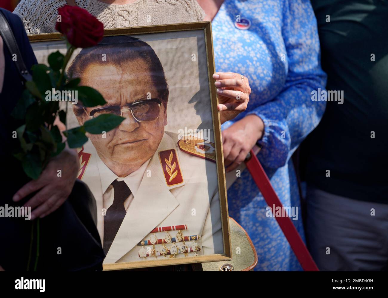 A woman holds picture of the late Yugoslav communist president Josip ...
