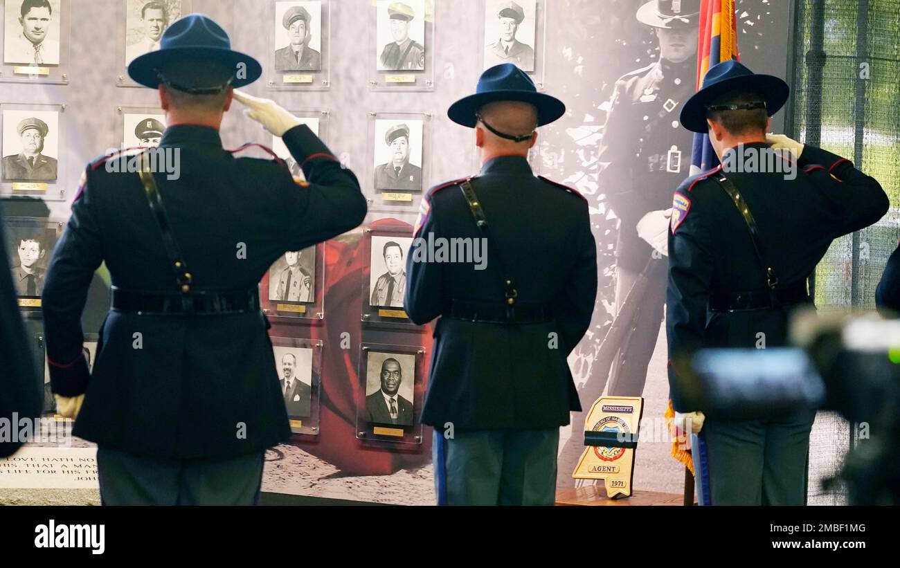 Mississippi Highway Patrol Honor Guard members salute before the mural ...