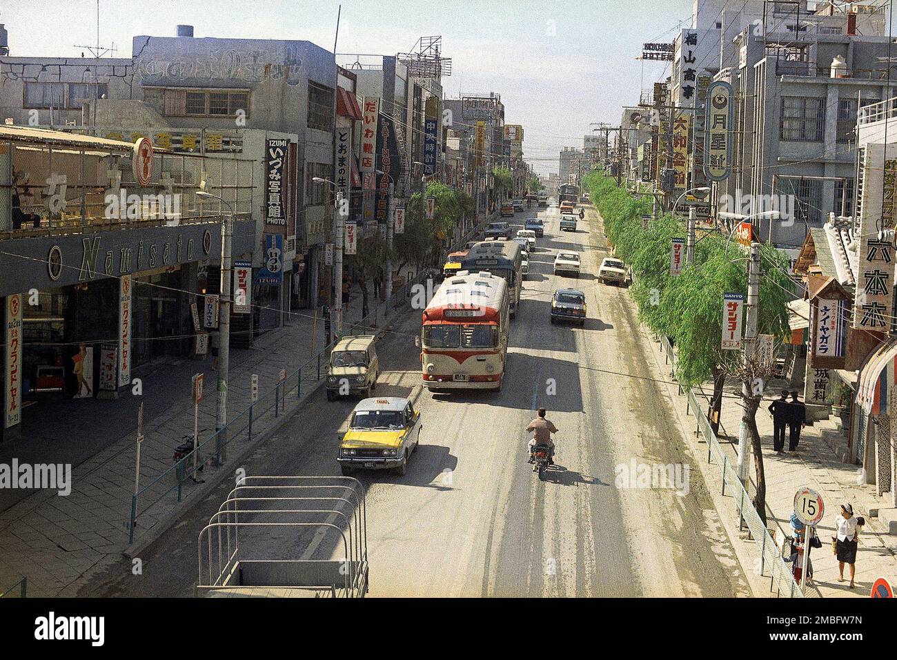 FILE - Vehicles are driven on the right side of a street, under the ...