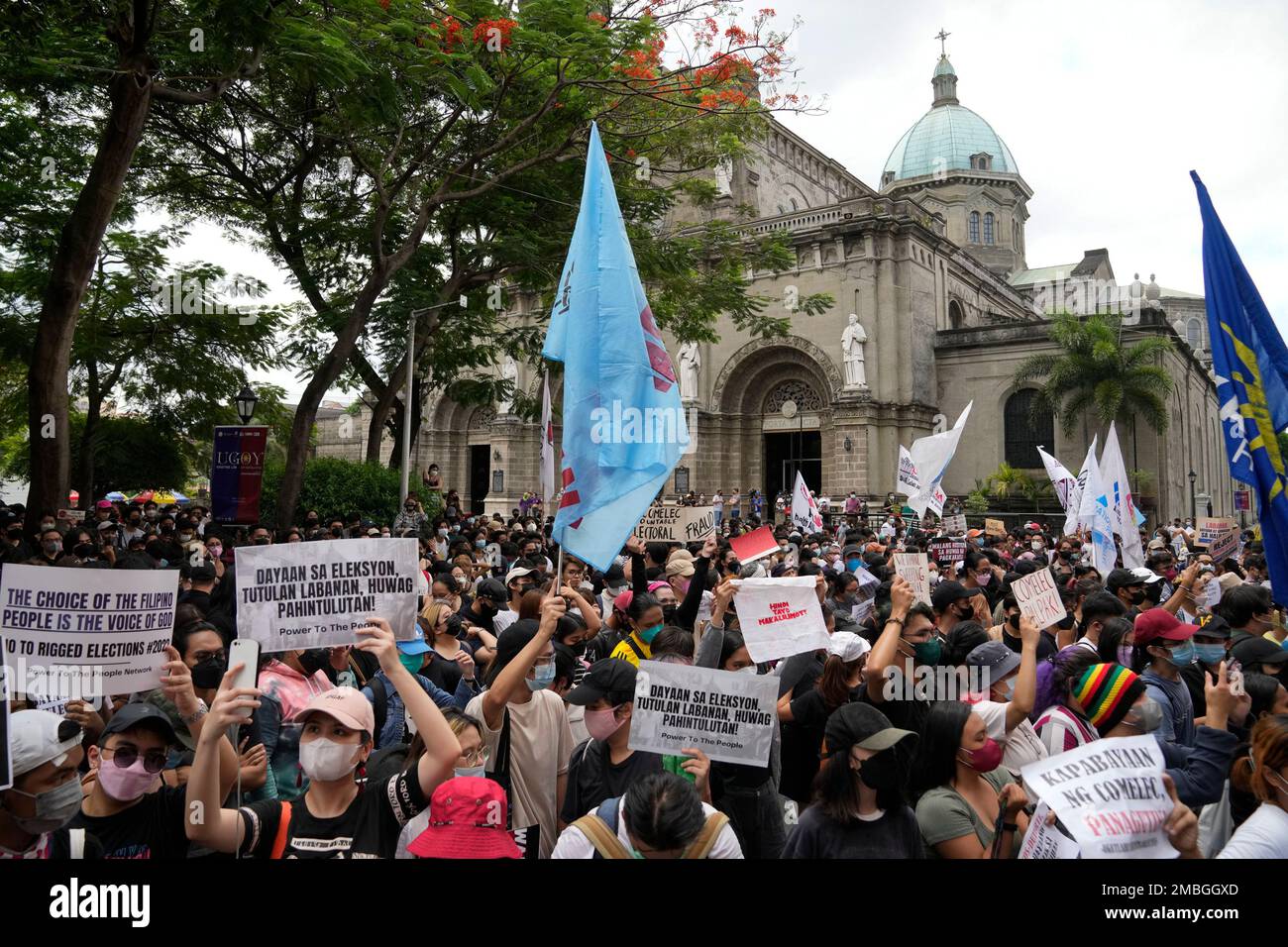 Students and activists hold slogans during a rally in front of the ...