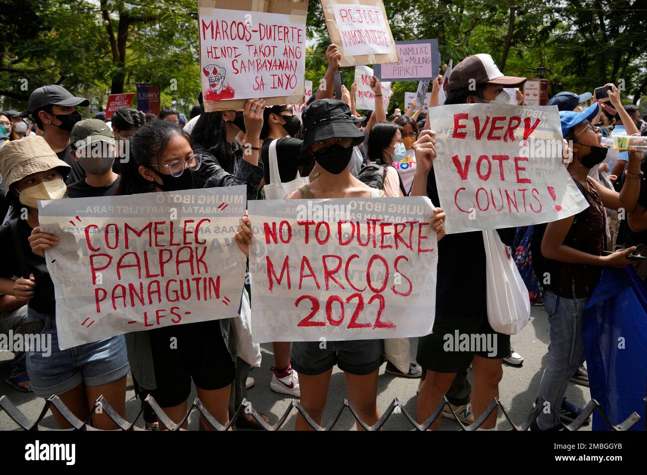 Students and activists hold slogans during a rally in front of the ...