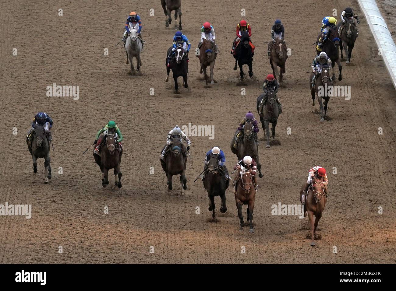 Rich Strike, with Sonny Leon aboard, lower right, lead the pack as they ...