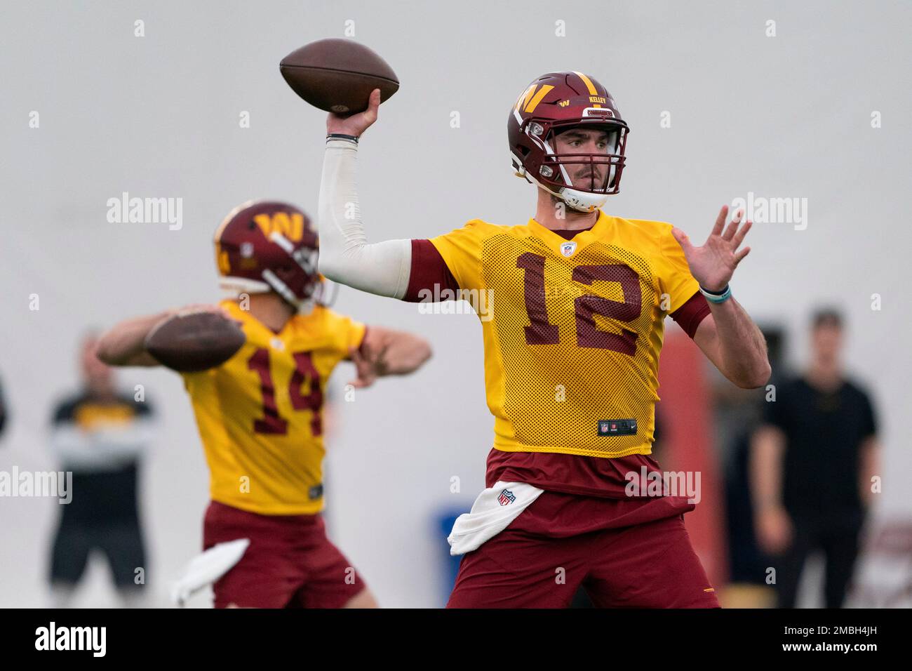 Washington Commanders quarterback Cole Kelley, right, and Sam Howell ...