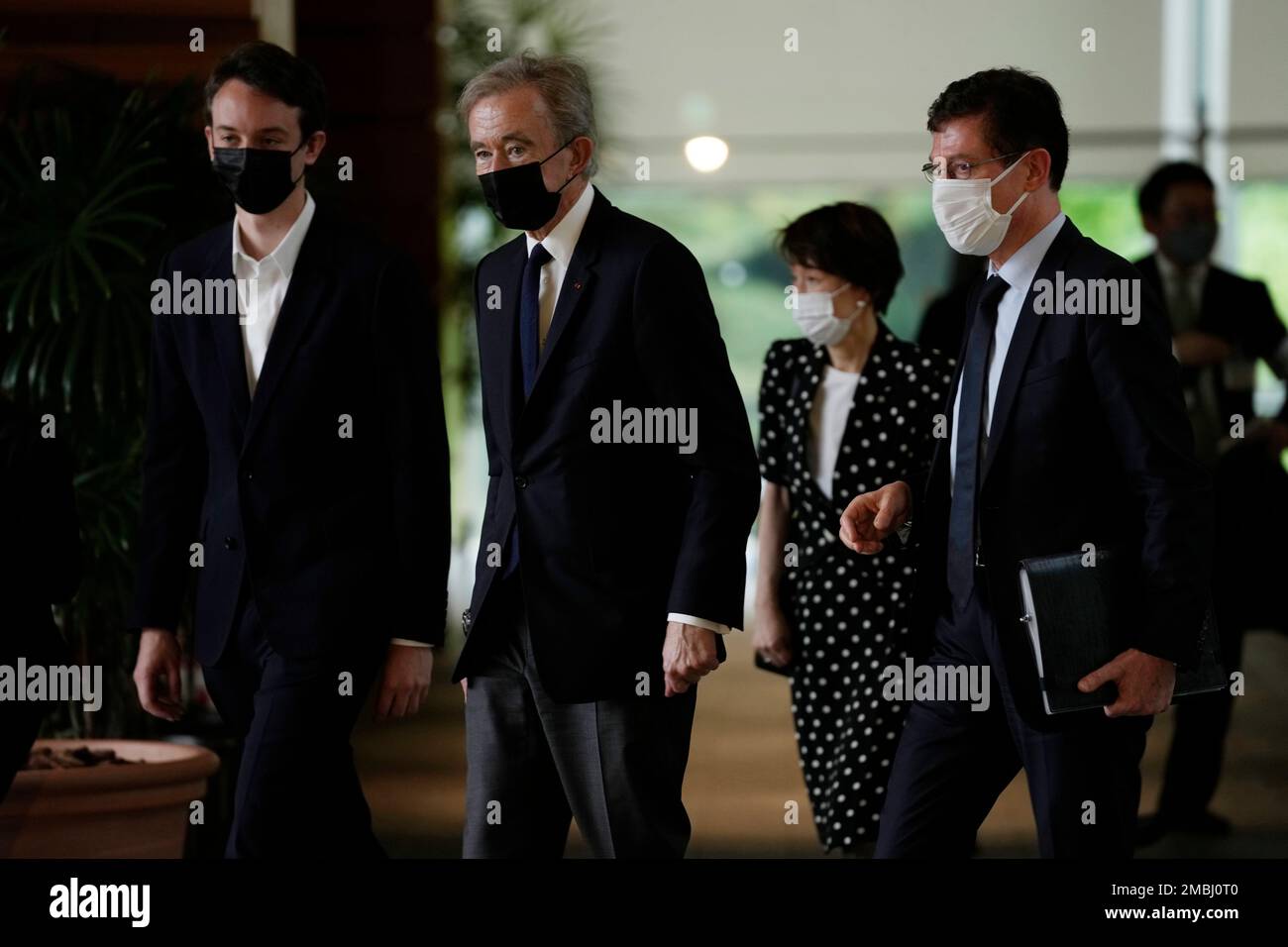 LVMH CEO Bernard Arnault, center, with his son and Tag Heuer CEO ...