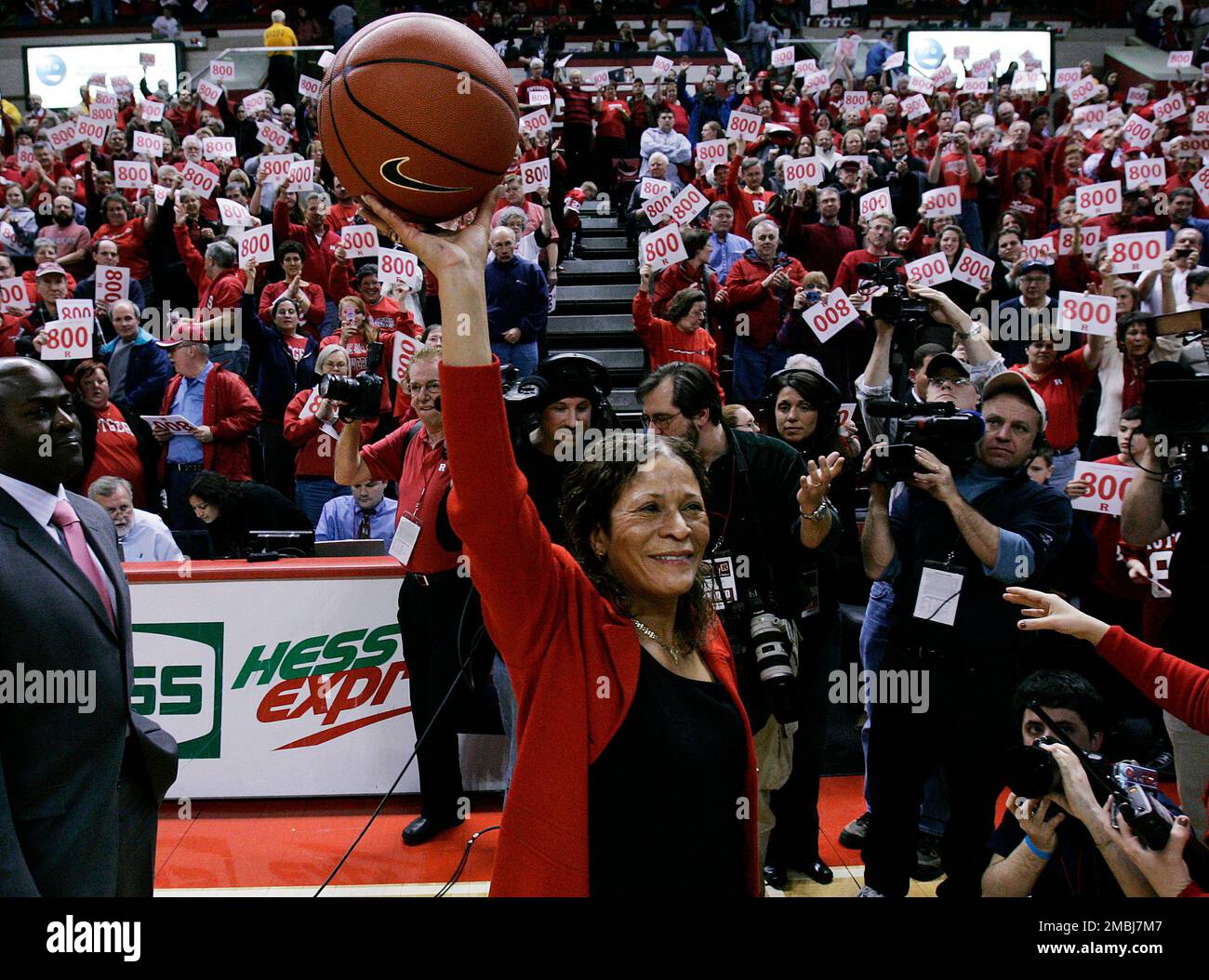 FILE - Rutgers head coach C. Vivian Stringer holds up a basketball as ...