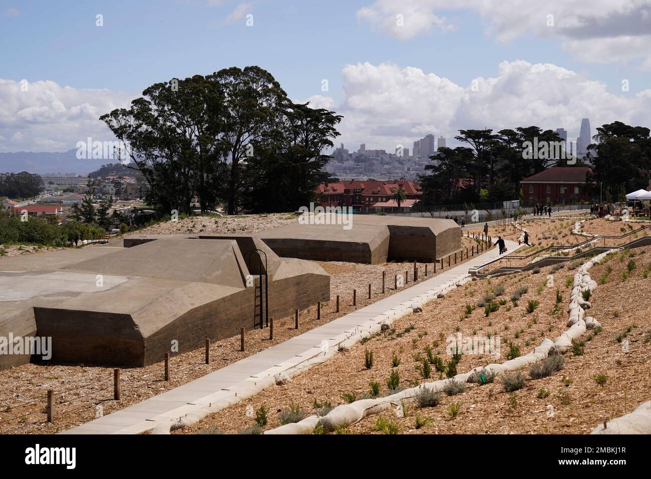 People walk along a pathway during a preview of Battery Bluff, six ...