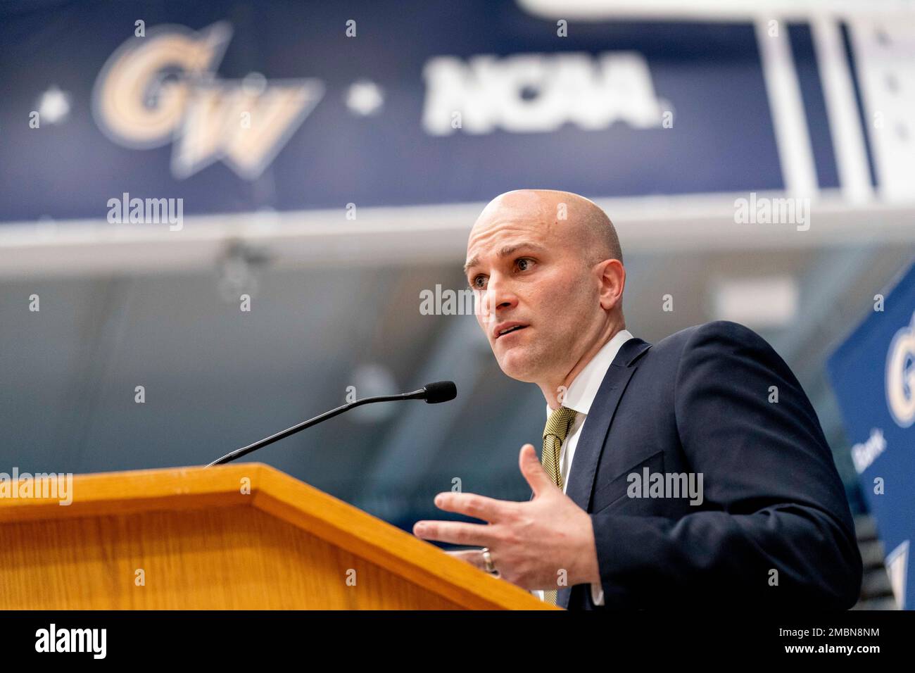 Chris Caputo speaks at an NCAA college basketball news conference at ...