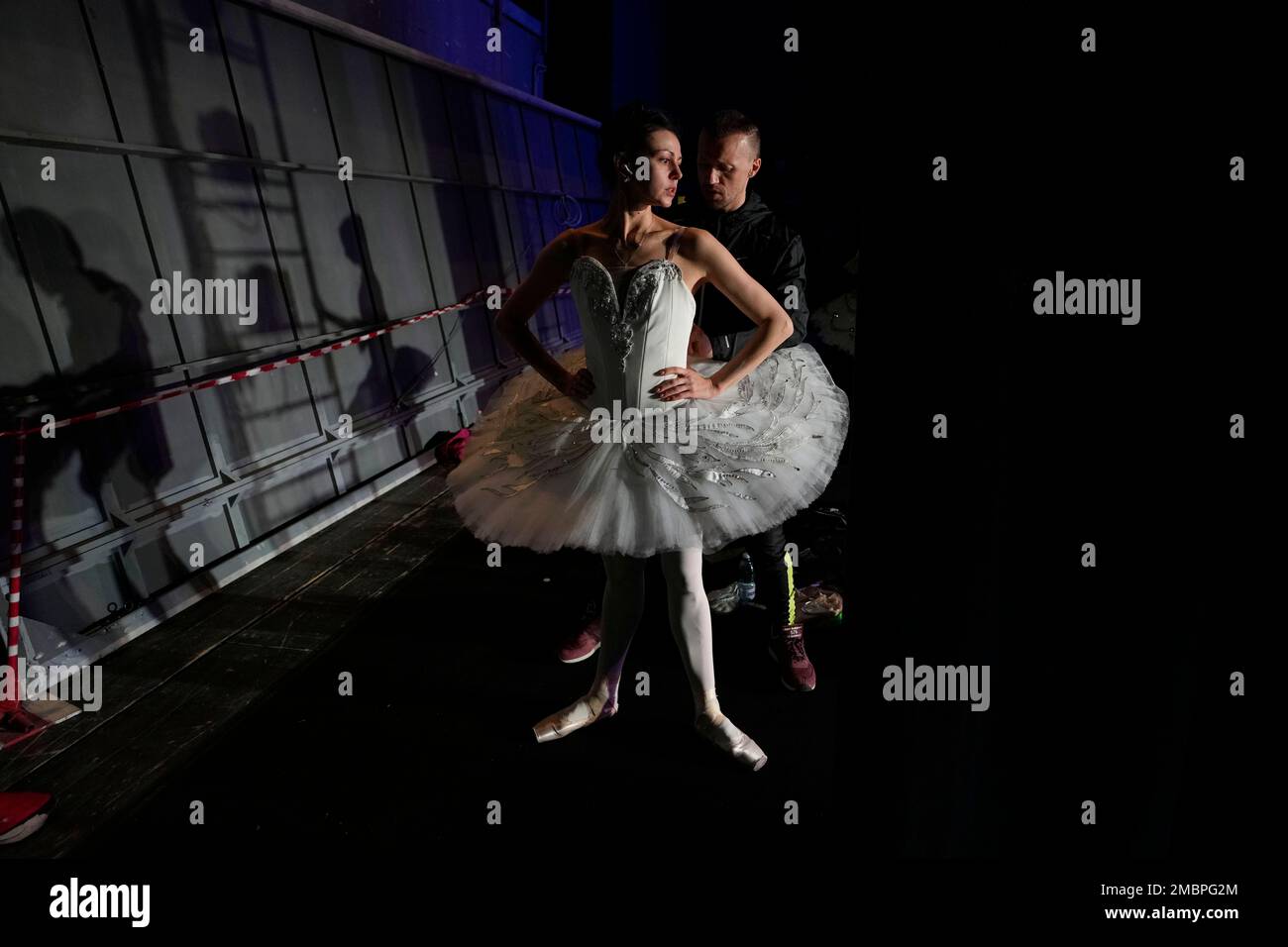 Anastasia Matvienko, and her husband Denis Matvienko, both from Ukraine, warm up before a ...