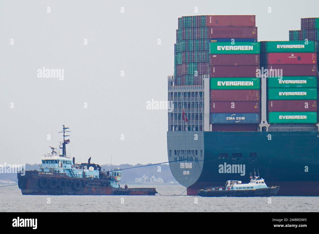 The tugboat Atlantic Enterprise, left, pulls the container ship Ever ...