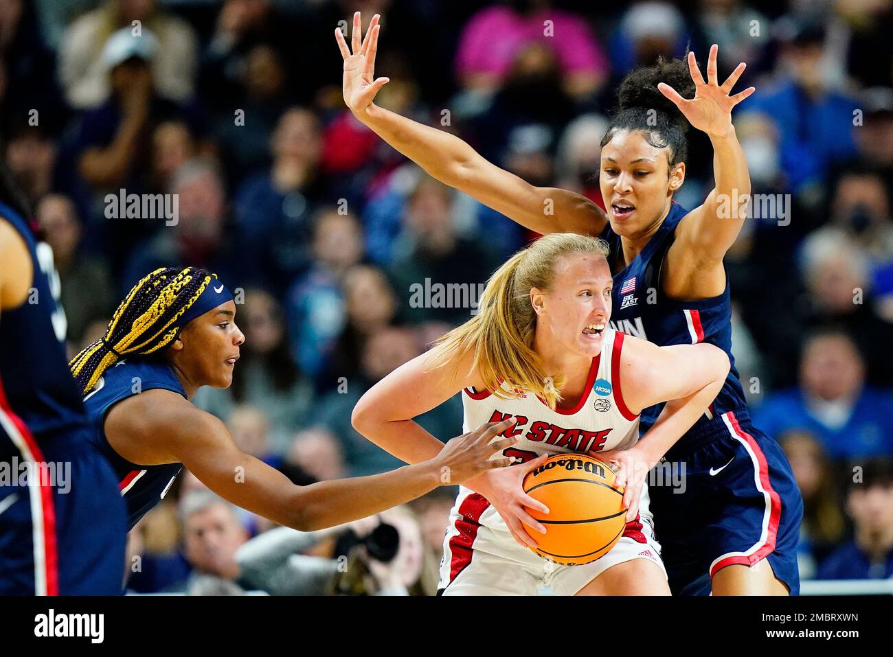 NC State center Elissa Cunane (33) is double teamed by Connecticut ...