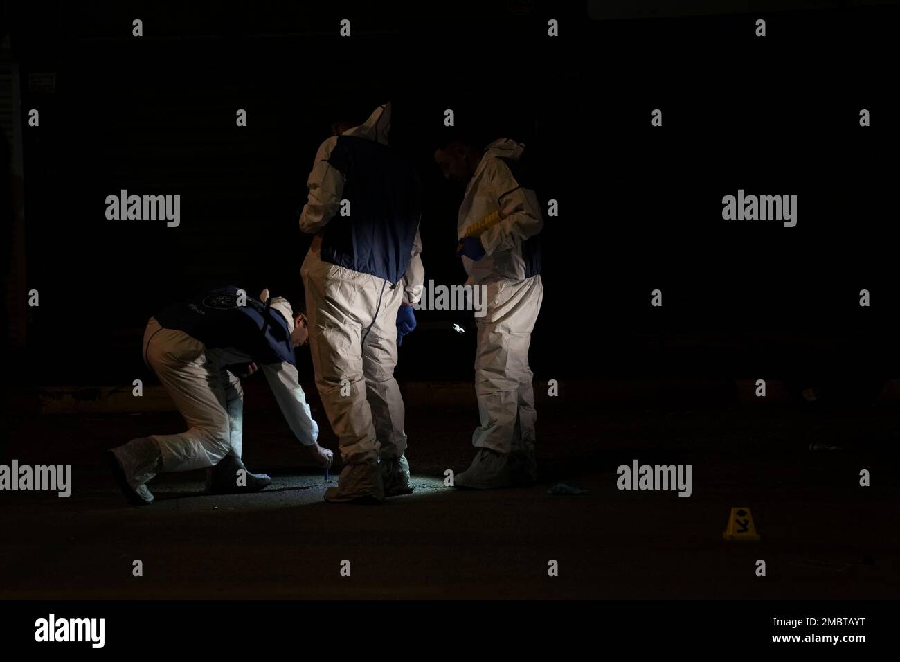 Israeli police inspect the scene of a shooting attack in Hadera, Israel ...