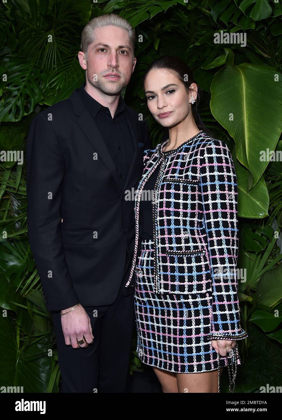 Michael Shuman, left, and Lily James arrive at the Chanel 13th annual ...