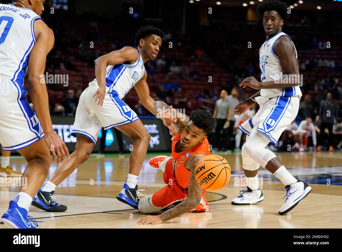 Cal State Fullerton guard Damari Milstead falls as Duke's Wendell Moore ...
