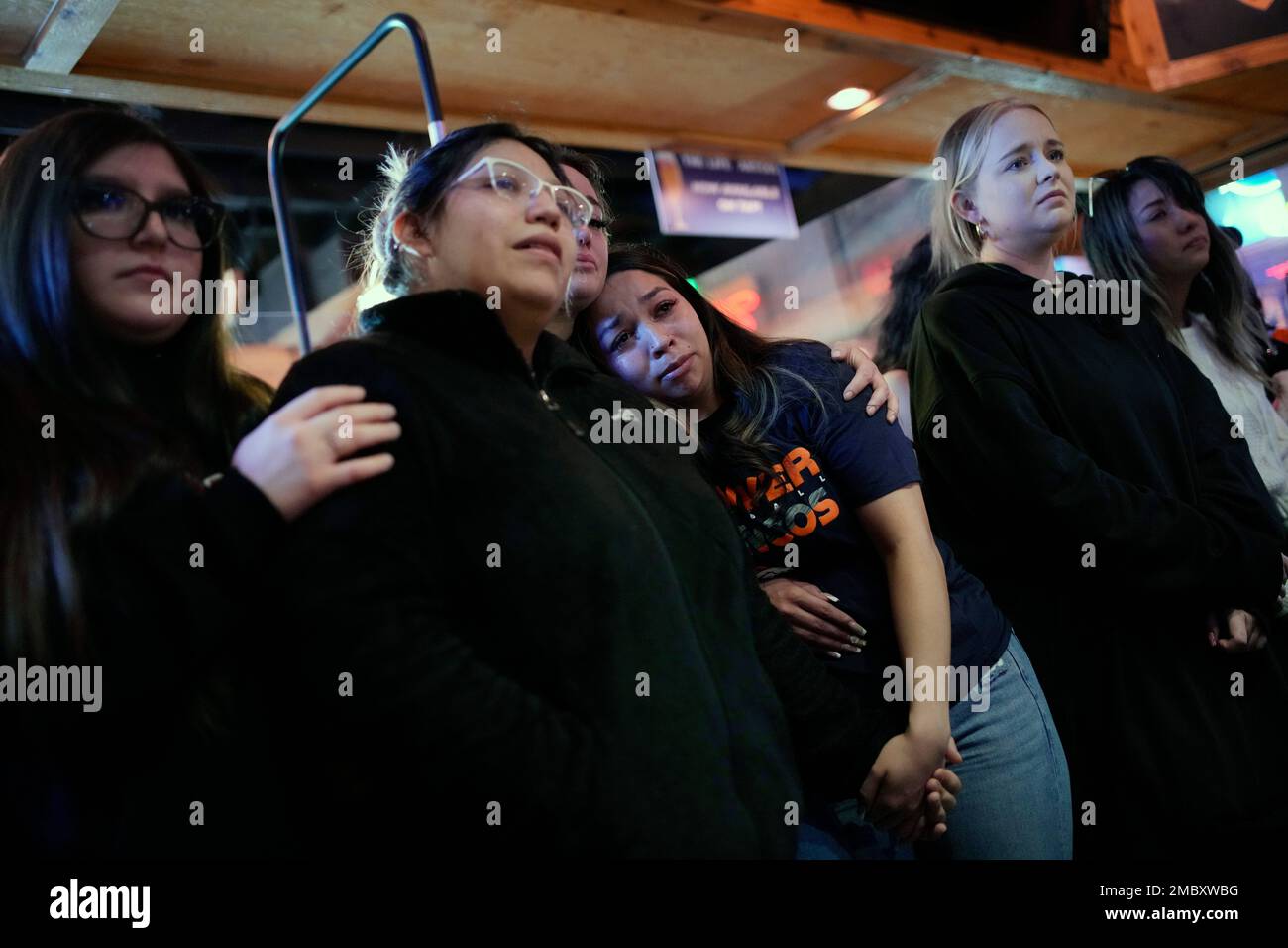 Bryanna Saiz, center, cries with others during a memorial for Jackson ...