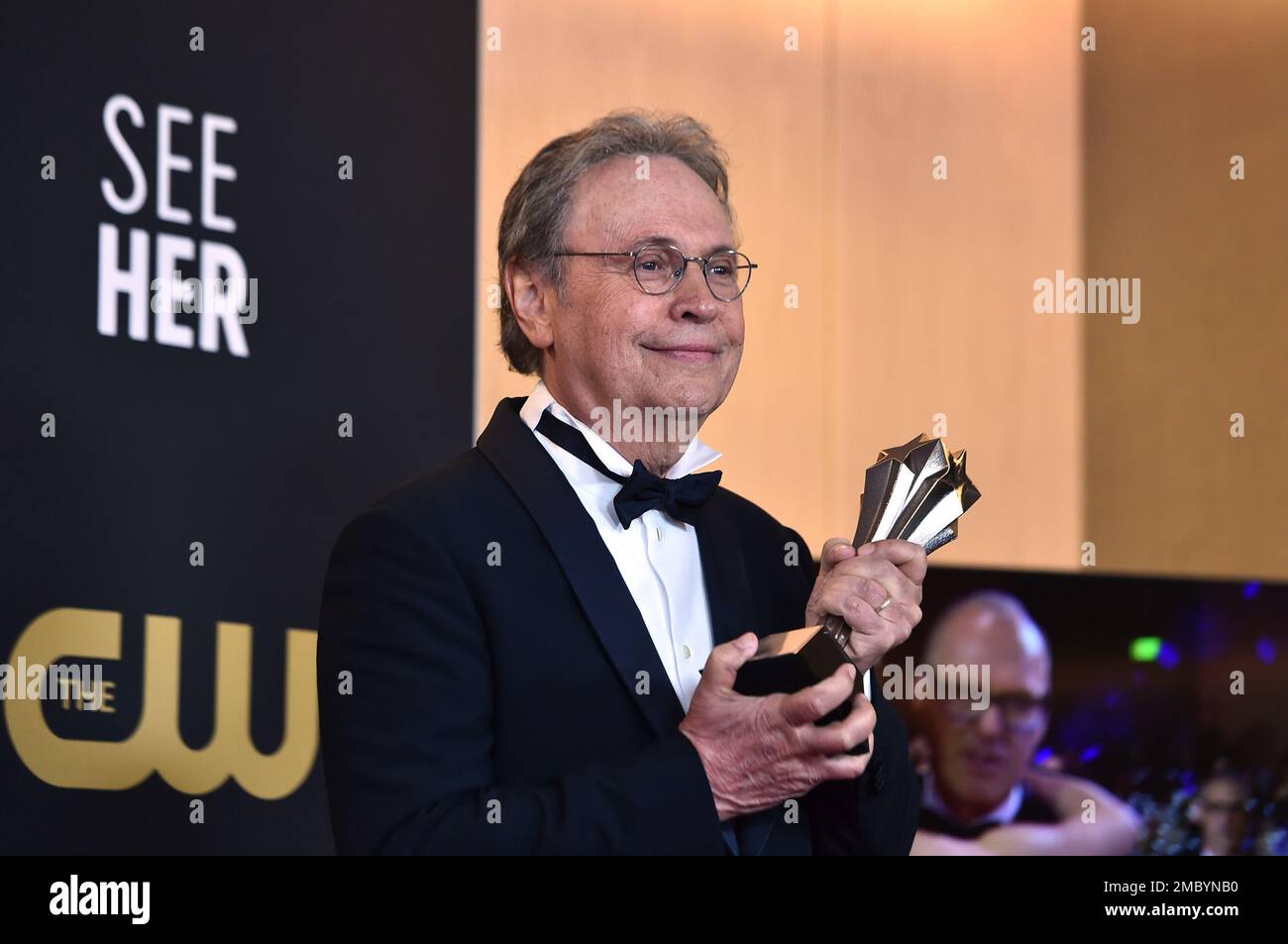 Billy Crystal poses in the press room with his lifetime achievement ...