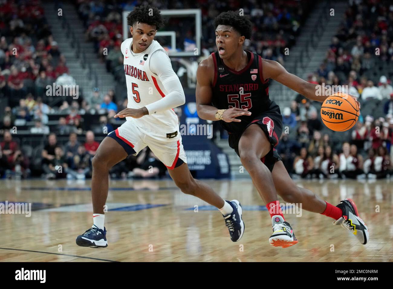 Stanford's Harrison Ingram (55) drives around Arizona's Justin Kier (5 ...
