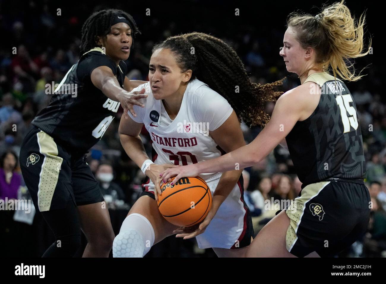 Stanford's Haley Jones (30) drives through Colorado's Jaylyn Sherrod ...