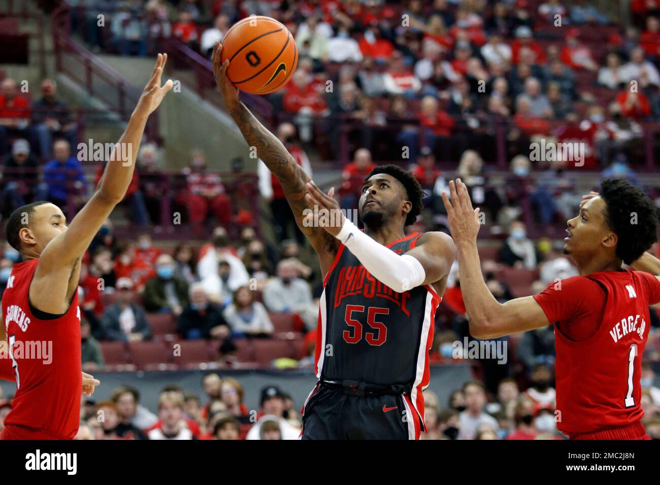 Ohio State guard Jamari Wheeler, center, goes up for a shot between ...