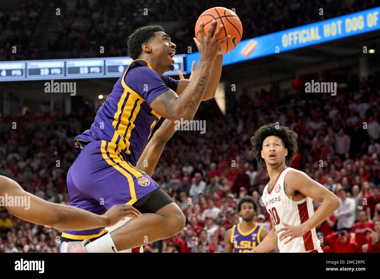 LSU guard Brandon Murray (0) drives past Arkansas guard Stanley Umude ...