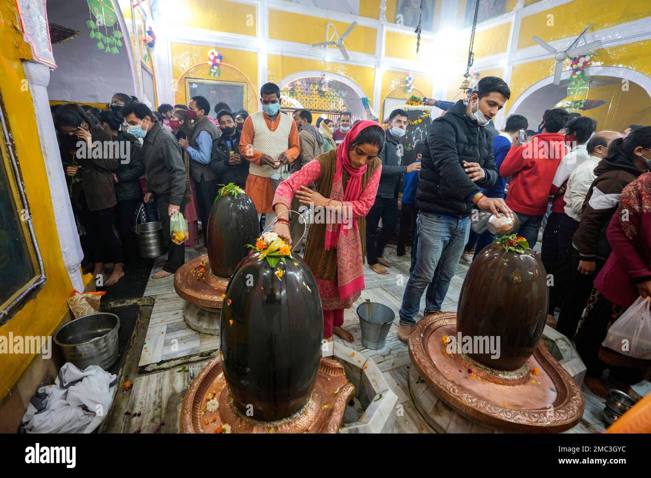 Hindu devotees worship Shivling, a representation of Hindu god Shiva ...