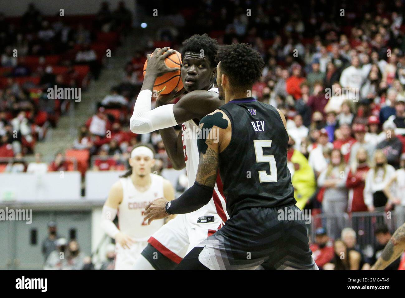 Washington State forward Mouhamed Gueye, left, controls the ball while ...