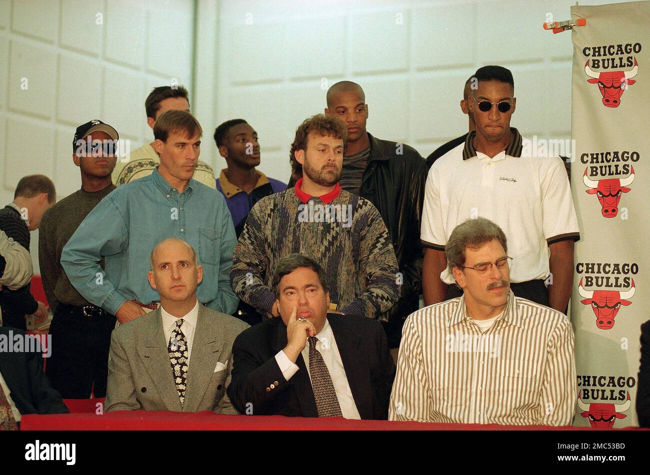 FILE - Members of the Chicago Bulls, along with coach Phil Jackson ...