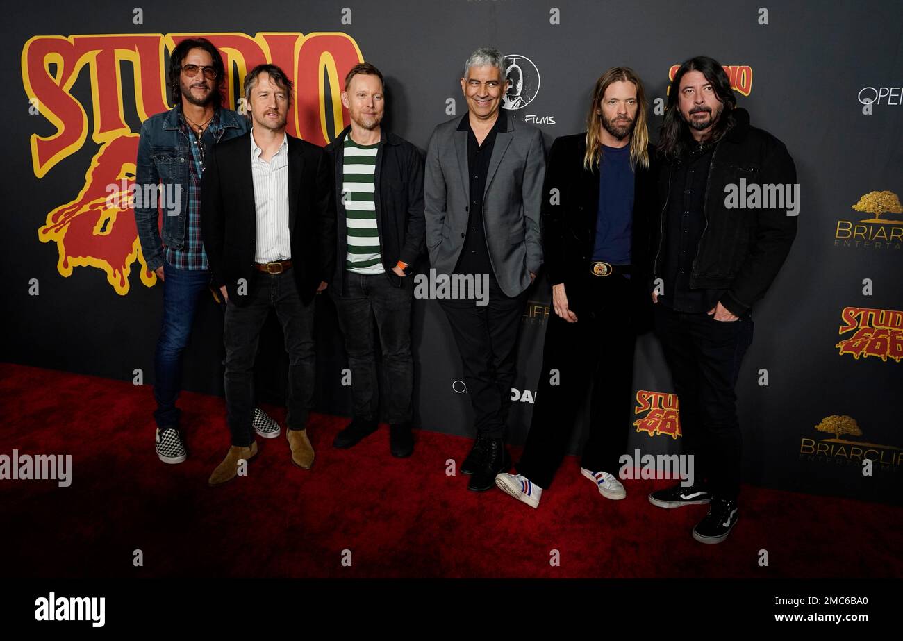 Foo Fighters band members and "Studio 666" cast members, from left ...