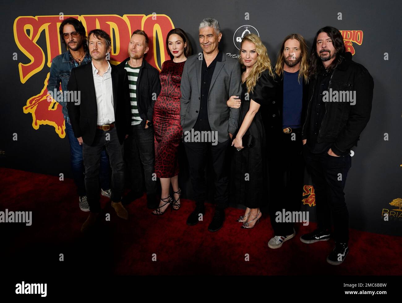 Foo Fighters band members and "Studio 666" cast members, from left ...