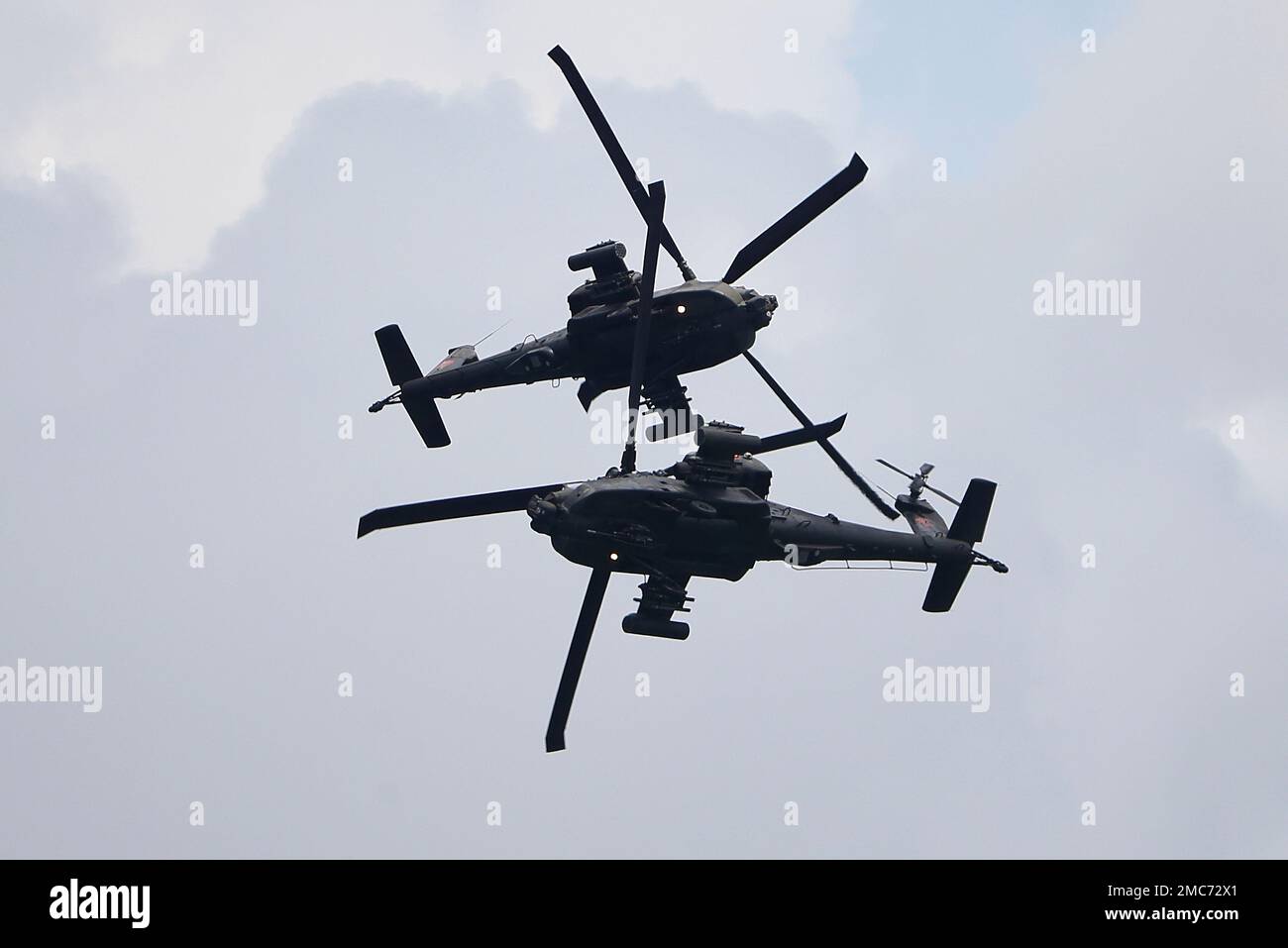 A pair of Republic of Singapore Air Force (RSAF) AH-64D Apache attack ...