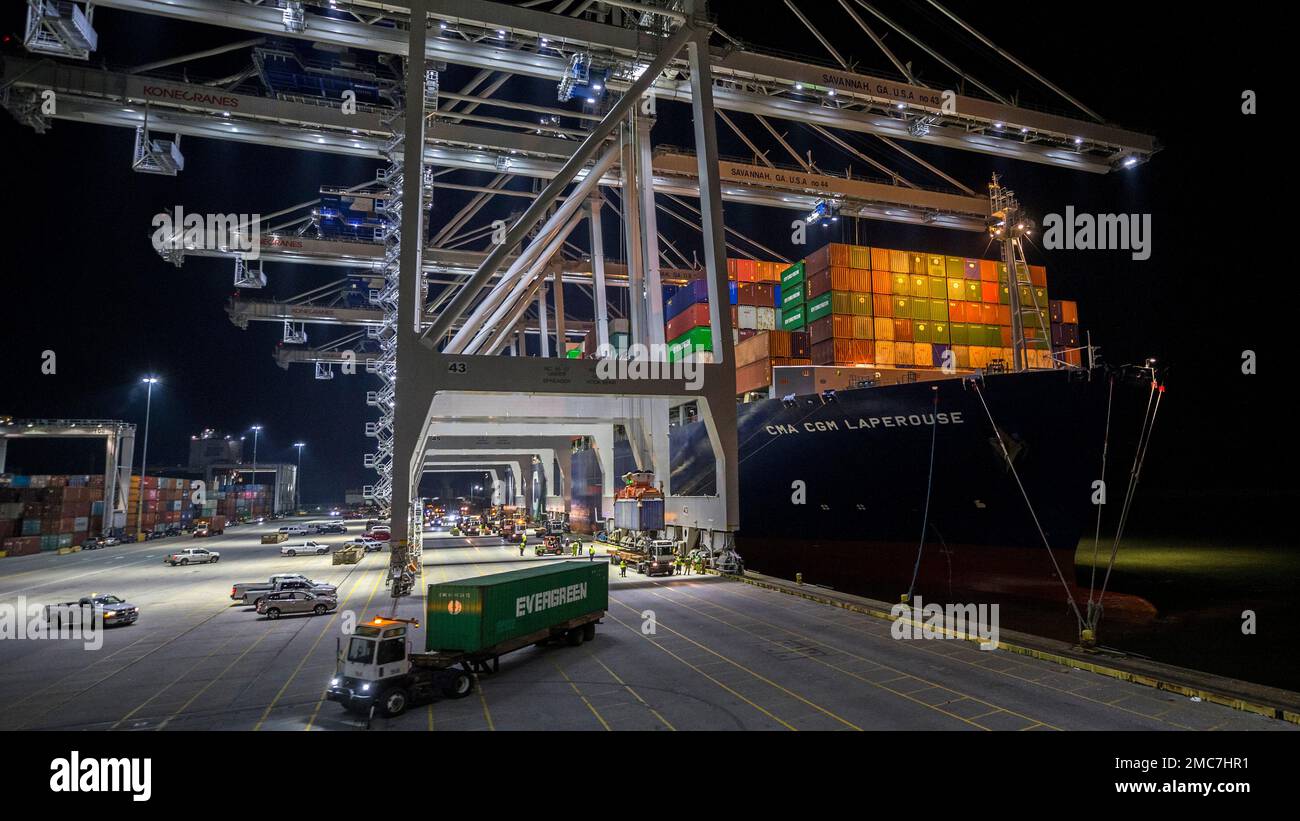 FILE - Five ship to shore cranes and gangs of longshoremen work to load ...