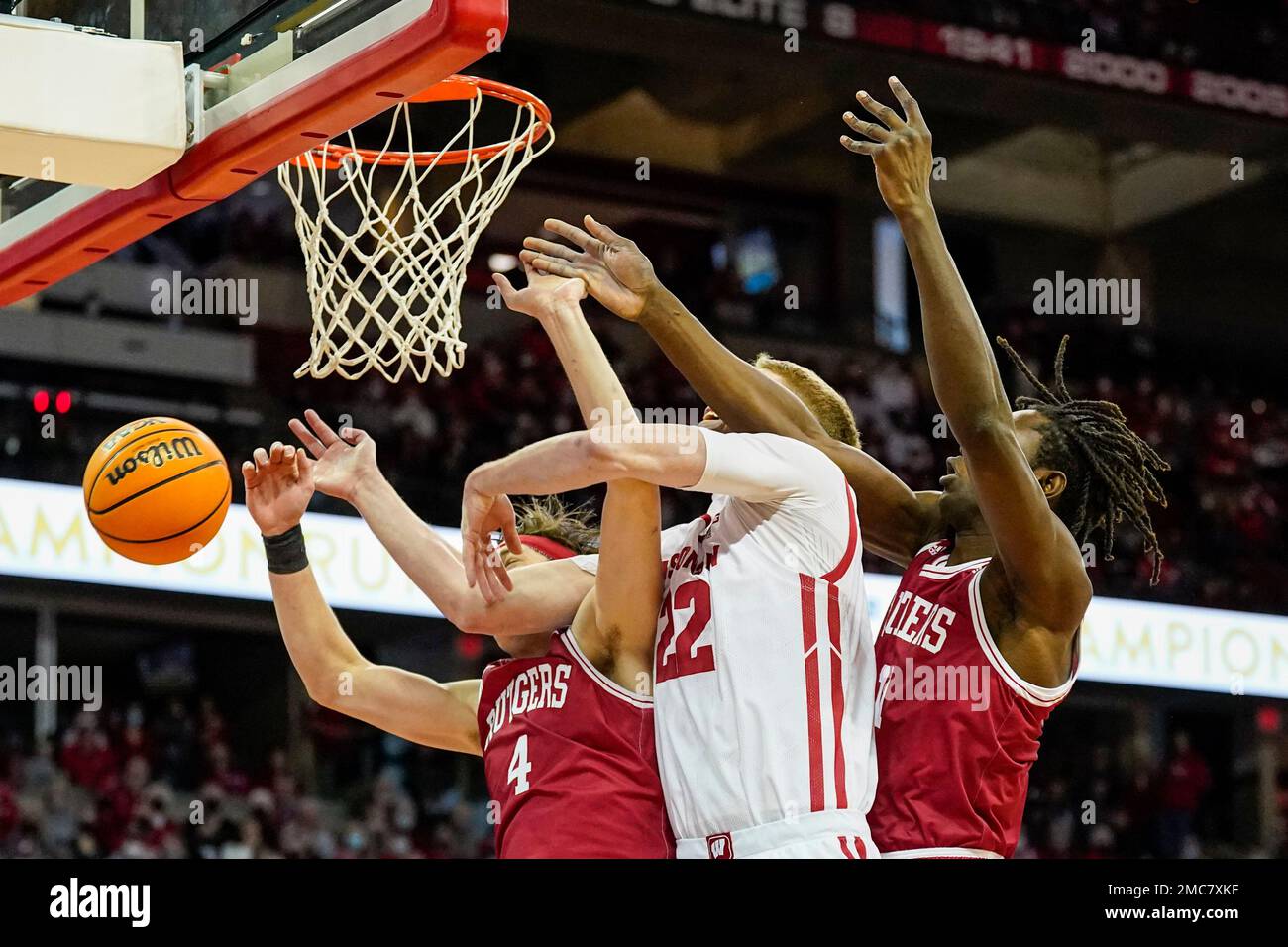 Wisconsin's Steven Crowl (22) battles against Rutgers' Paul Mulcahy (4 ...