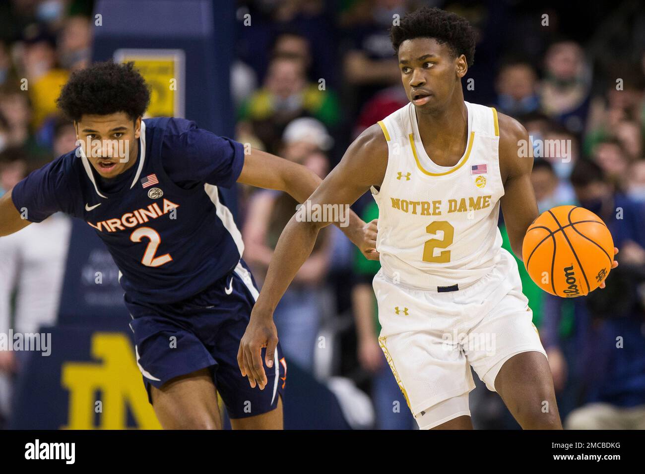 Notre Dame's Trey Wertz, right, drives downcourt next to Virginia's ...
