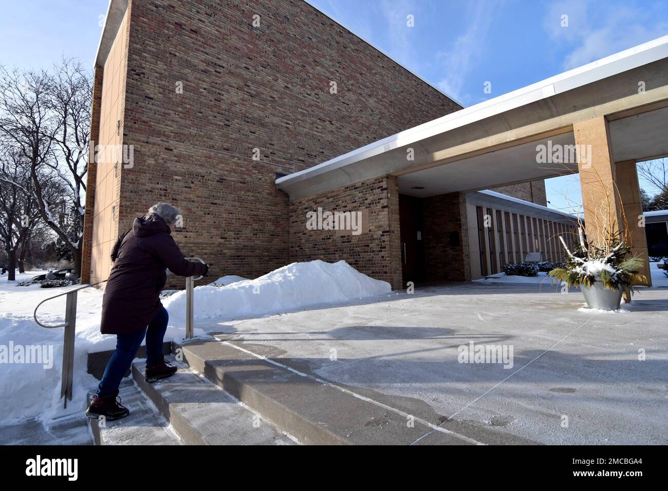 A woman arrives for the service at Christ Church Lutheran, Sunday, Jan ...