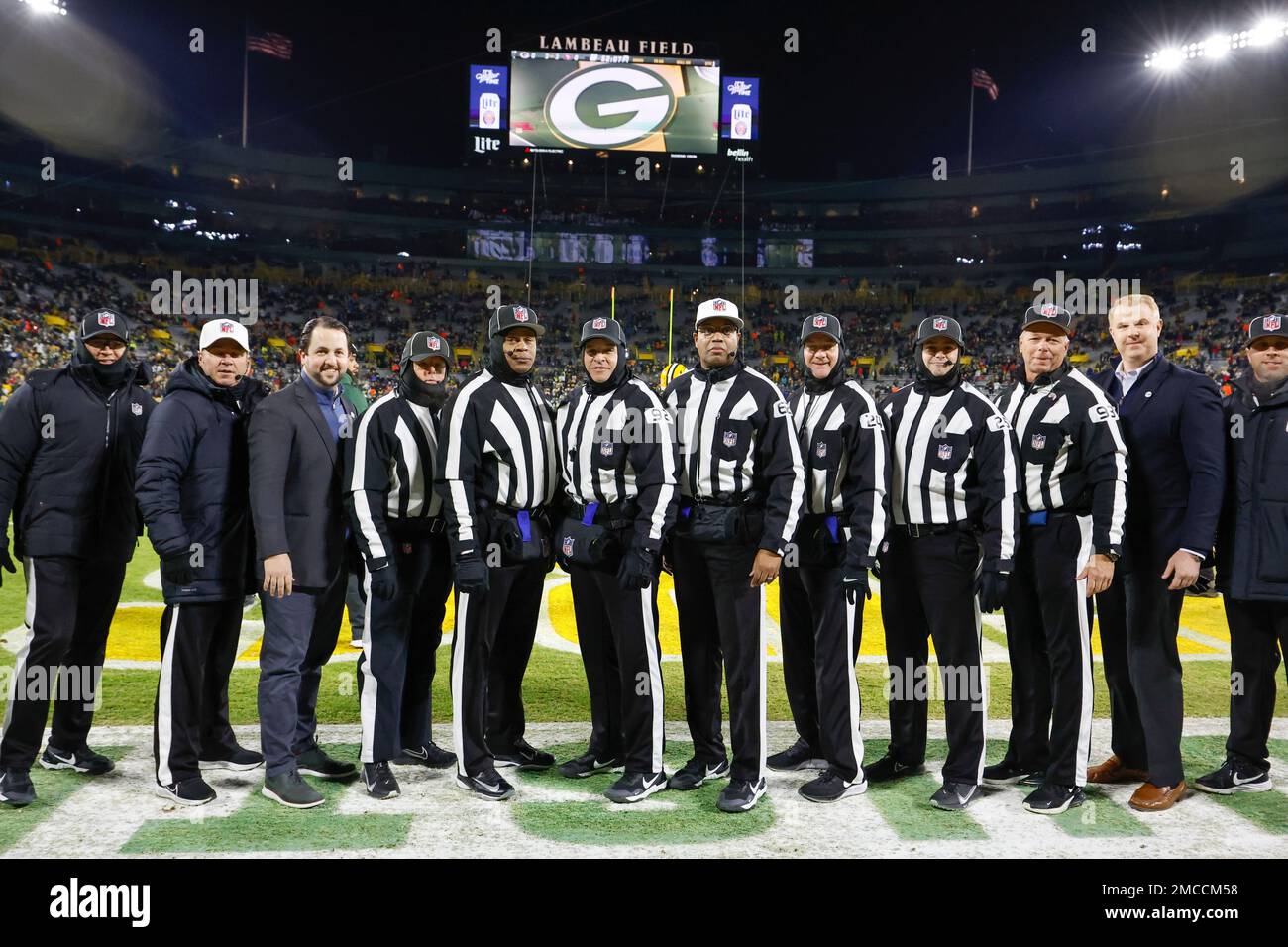 The officiating crew pose for a picture including line judge Rusty ...
