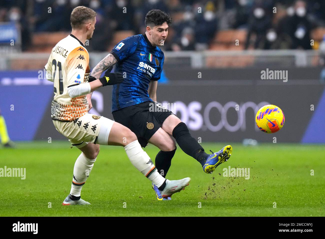 Inter Milan's Alessandro Bastoni, right, and Venezia's Michael Cuisance ...