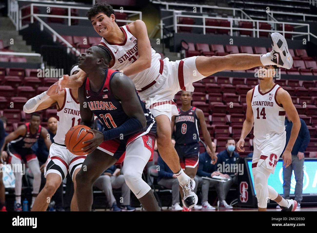 Arizona center Oumar Ballo (11) is fouled by Stanford forward Brandon ...