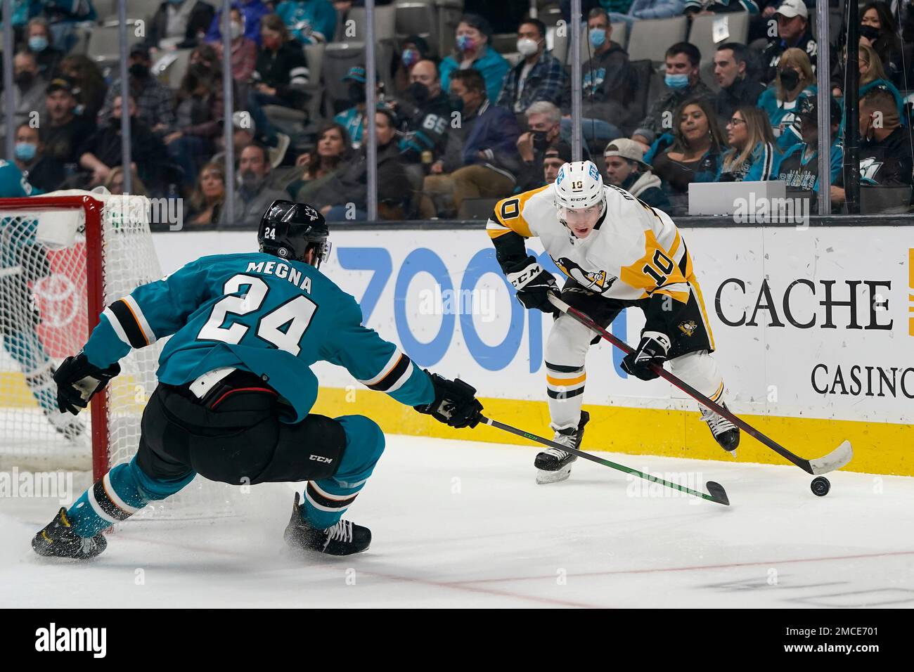 Pittsburgh Penguins left wing Drew O'Connor (10) skates with the puck ...