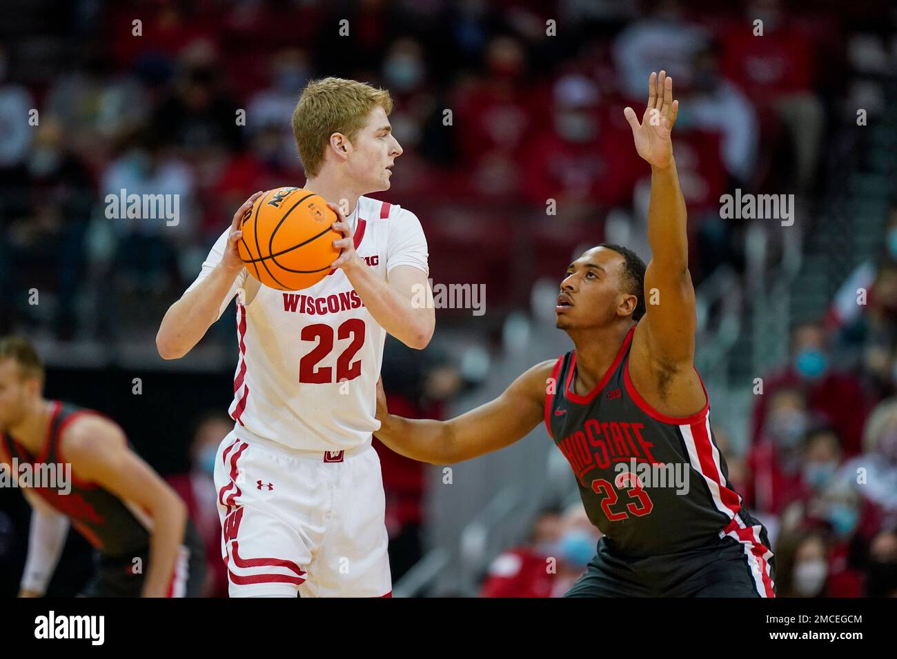 Wisconsin's Steven Crowl (22) and Ohio State's Zed Key (23) during the ...