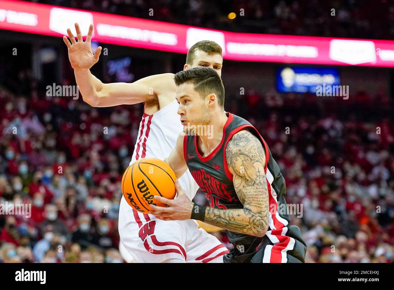 Ohio State's Zed Key (23) drives against Wisconsin's Chris Vogt (33 ...