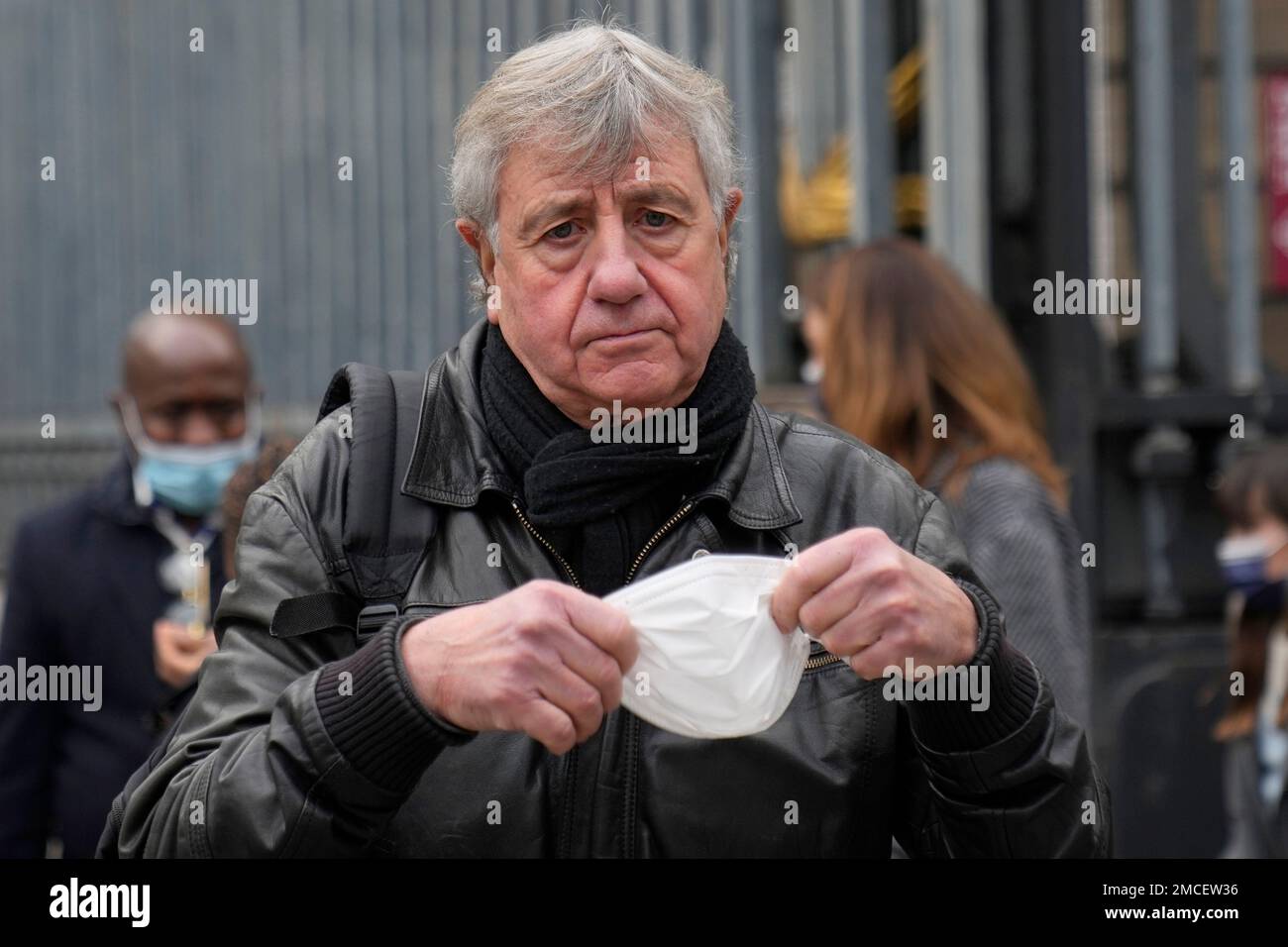 Former Italian left-wing militant Giovanni Alimonti leaves after an ...