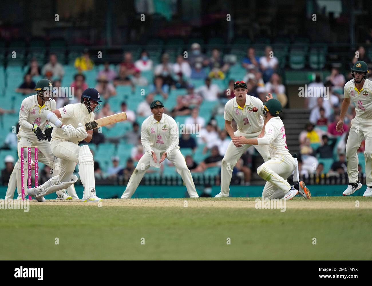 England's Stuart Broad, second left, is surrounded by Australian ...