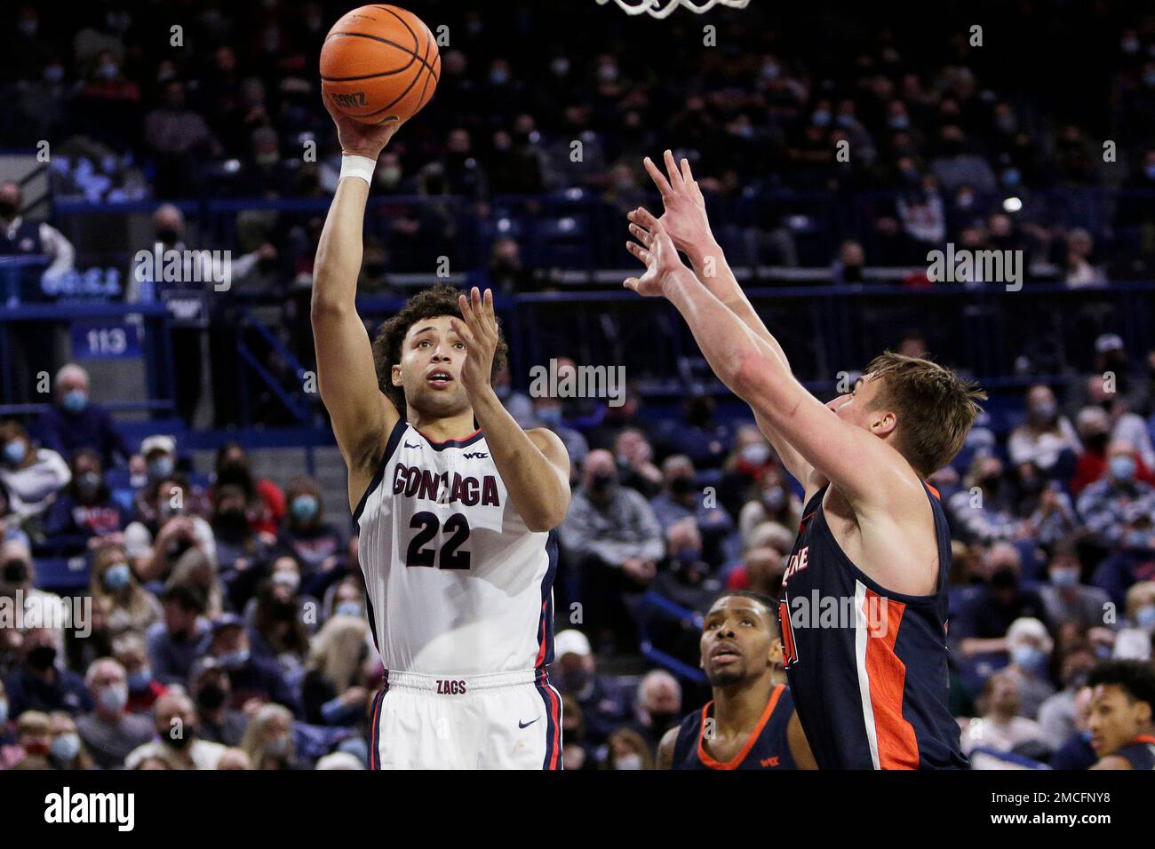 Gonzaga forward Anton Watson, left, shoots next to Pepperdine forward ...